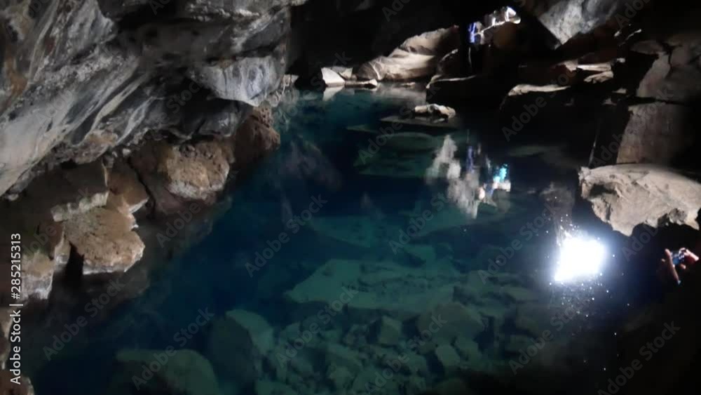 Grjotagja volcanic cave with blue hot thermal water near Lake Myvatn ...