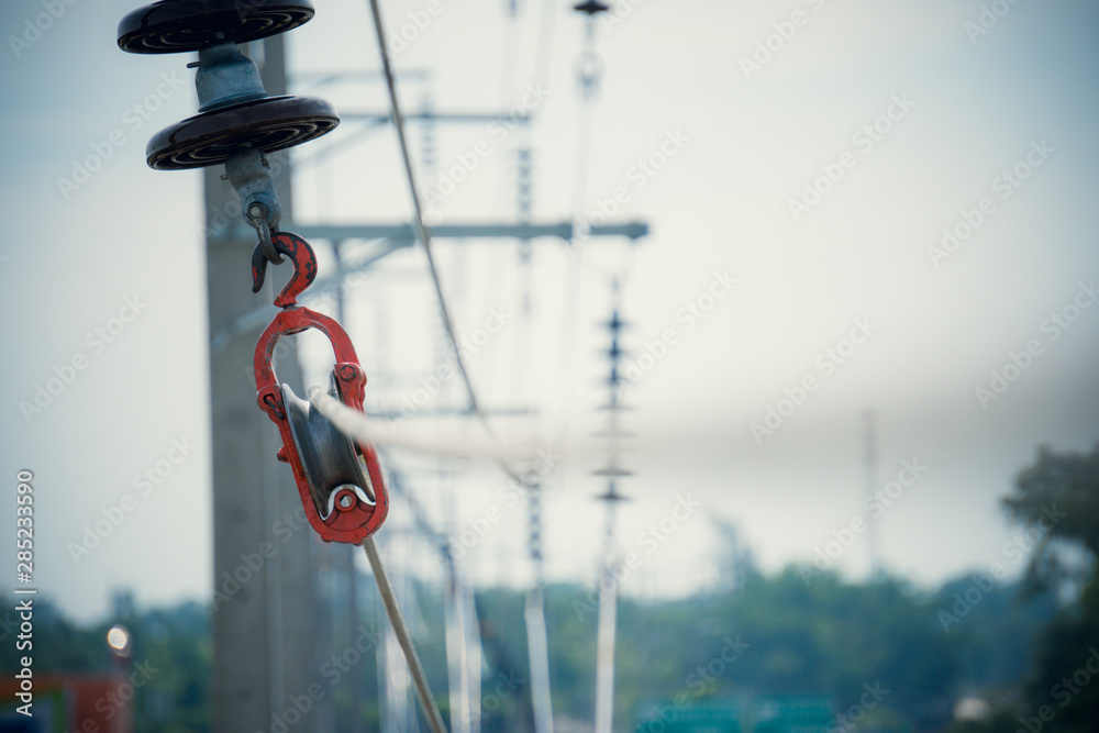 Construction process install aluminum electrical wires with insulators ...