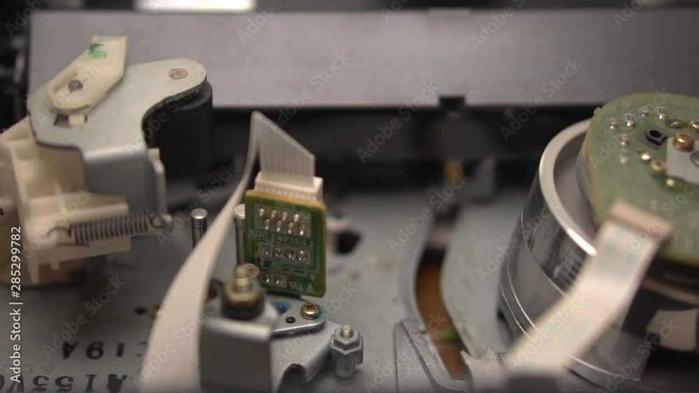VCR cassette mechanism. Close-up. Rewind of magnetic videotape in the ...