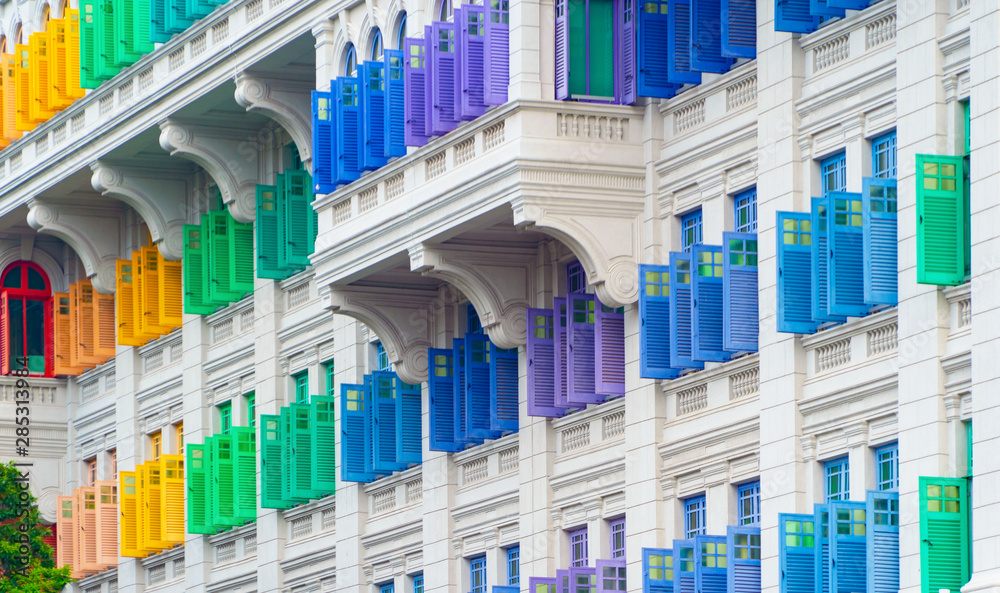Colorful rainbow pastel building with facade windows background ...