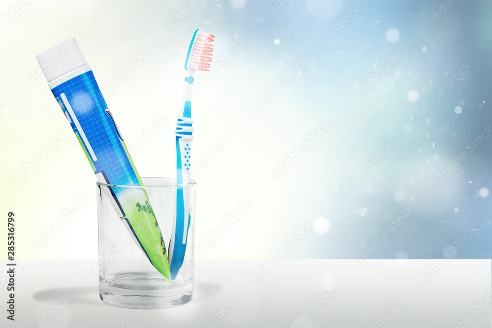 Tube of toothpaste and a toothbrush on backgrouund Stock Photo | Adobe ...