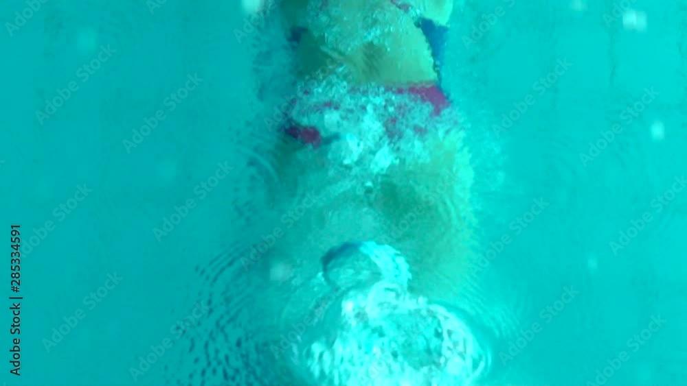 Girl Swimmer Dive In Swimming Pool. Female swimmer dives in swimming ...