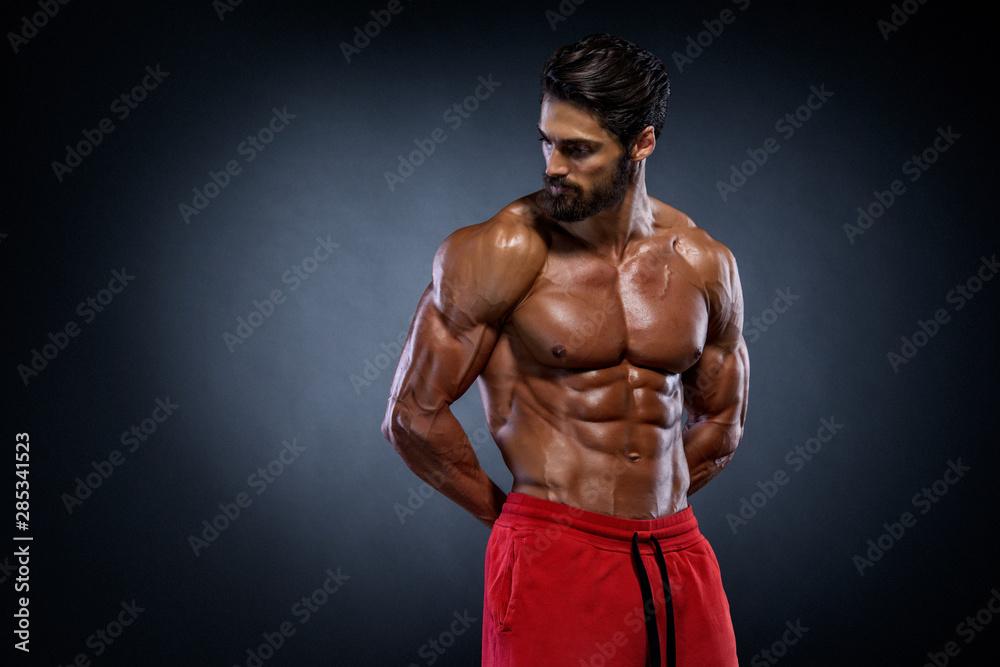 Handsome Muscular Men Posing and Flexing Muscles Stock Photo | Adobe Stock
