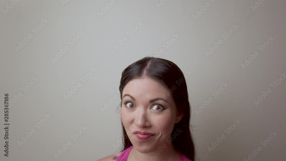 Girl rotates around, makes awkward stink facial expressions, 4k ...