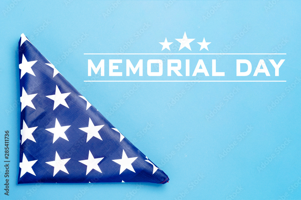 Folded USA flag on a blue background. Concept Memorial Day ...