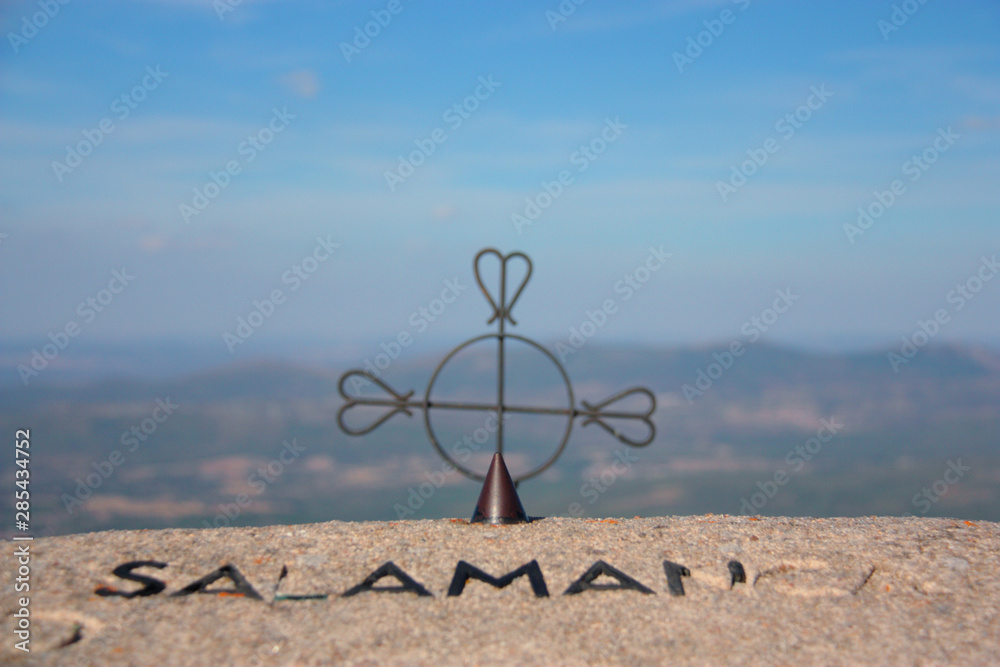 The ancient medieval built-in metal pointer to the city of Salamanca ...
