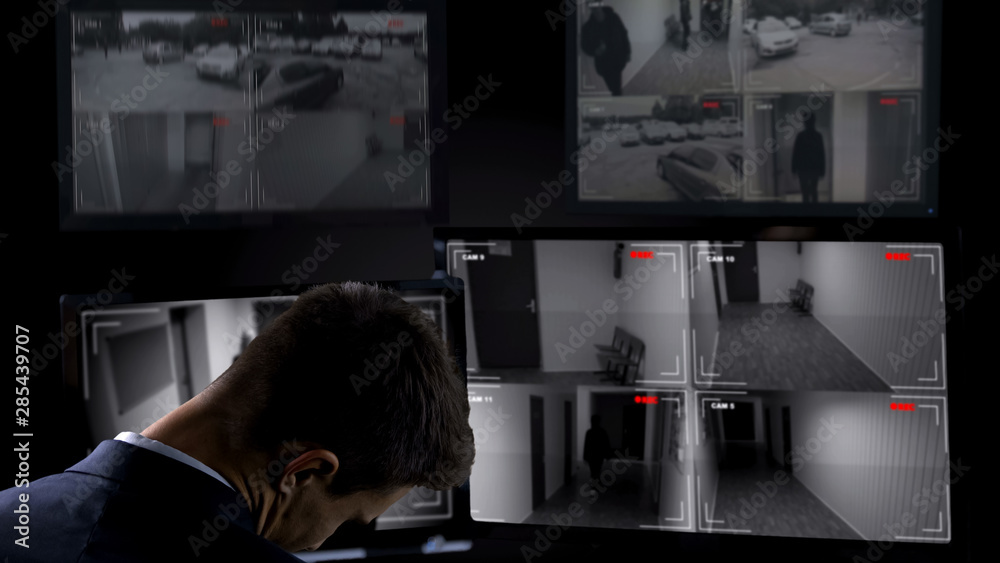 Security guard sleeping in front of surveillance camera, twenty-for ...