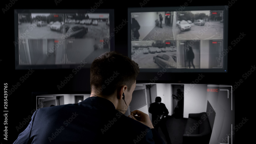 Security guard watching CCTV footage, calling police, thief break in ...