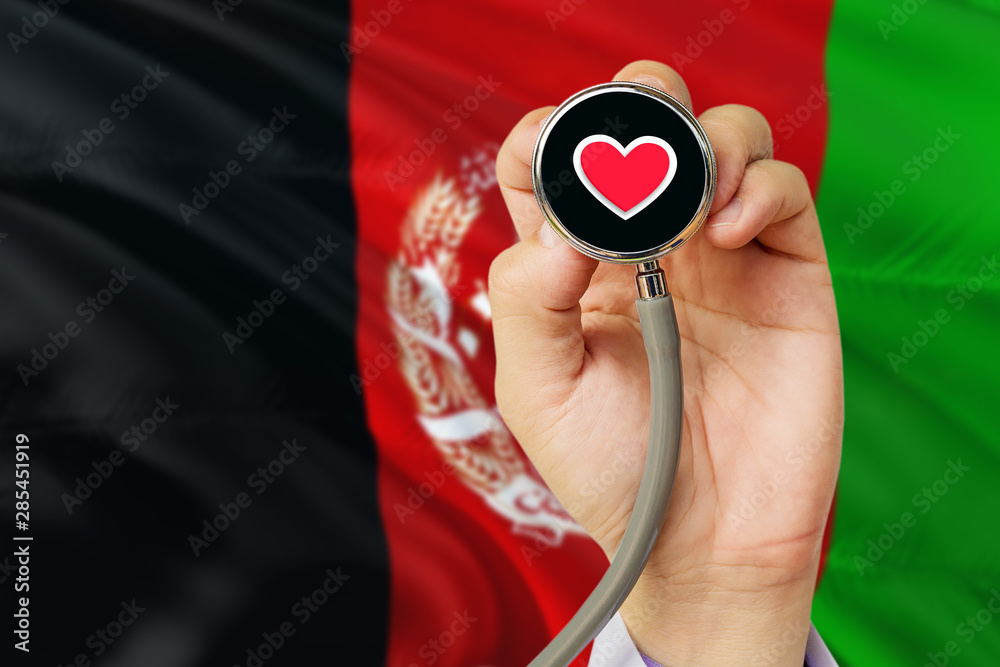 Doctor holding stethoscope with red love heart. National Afghanistan ...