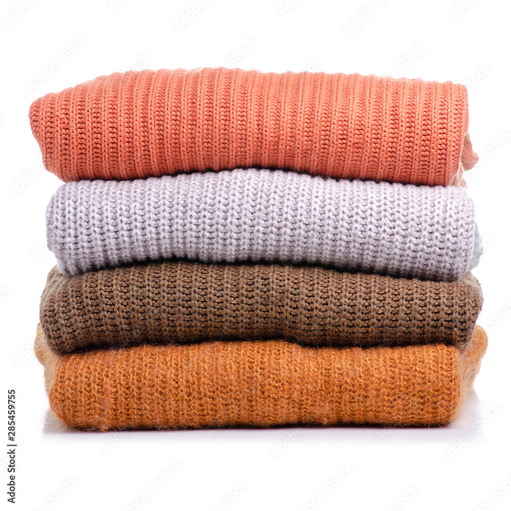 Stack folded sweater clothing on white background isolation Stock Photo ...