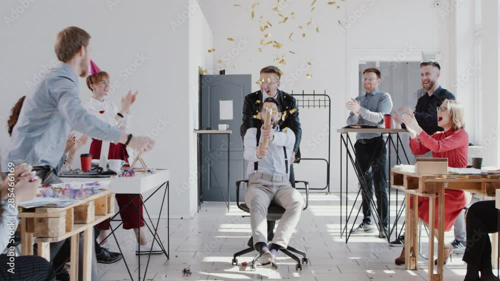 RED EPIC Happy young boss celebrates success with colleagues team and ...