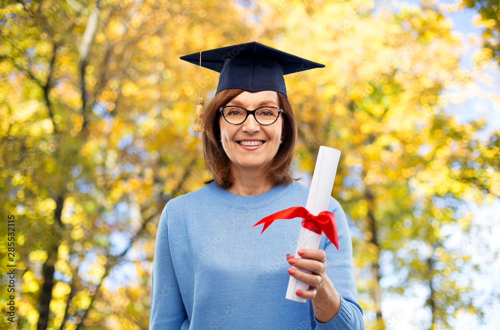 graduation, education and old people concept - happy senior graduate ...