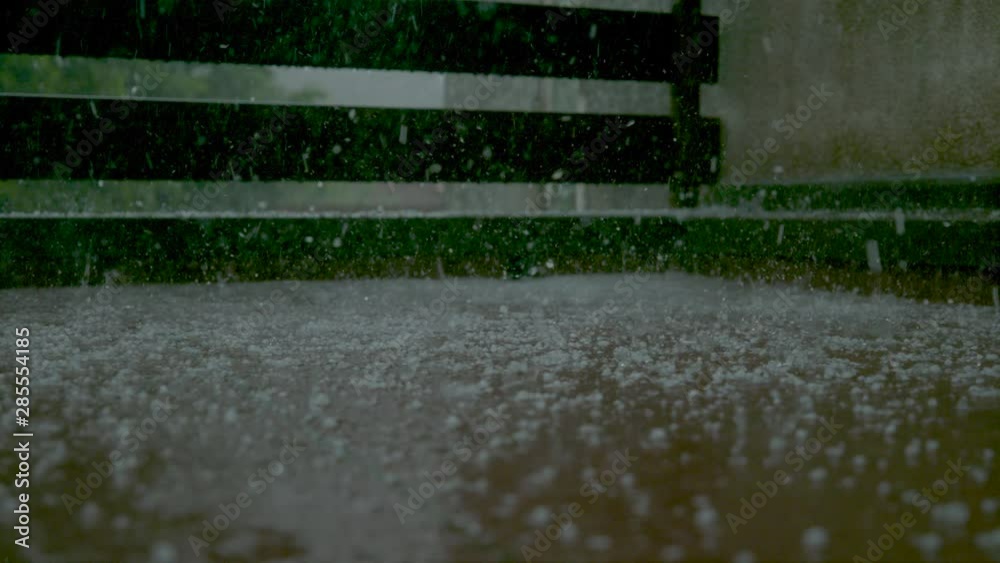 Vidéo Stock SLOW MOTION, CLOSE UP, DOF: Raindrops and soft hail fall ...