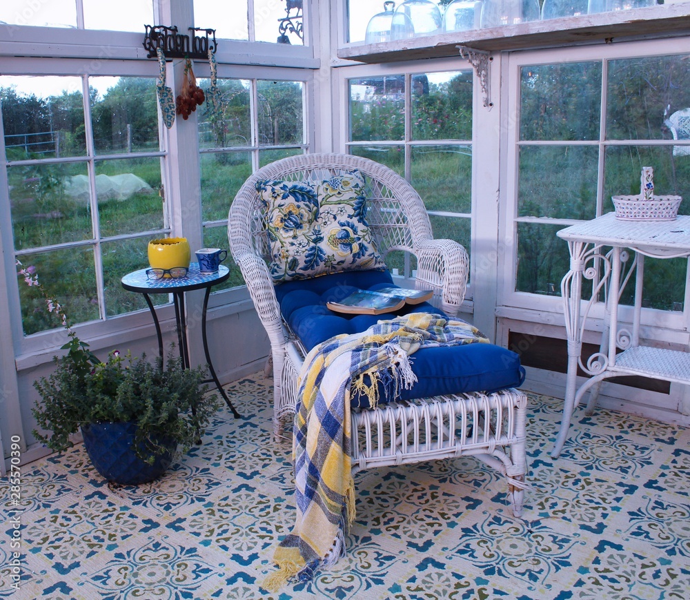 Beautifully decorated interior of a greenhouse/summer house with ...
