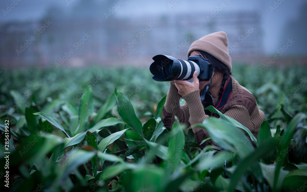 female stocker photographer are carefully photographing her in the ...