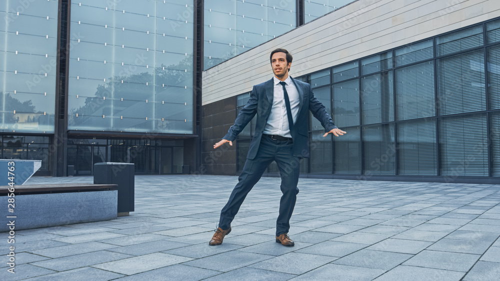 Cheerful and Happy Businessman in a Suit is Actively Dancing on a ...