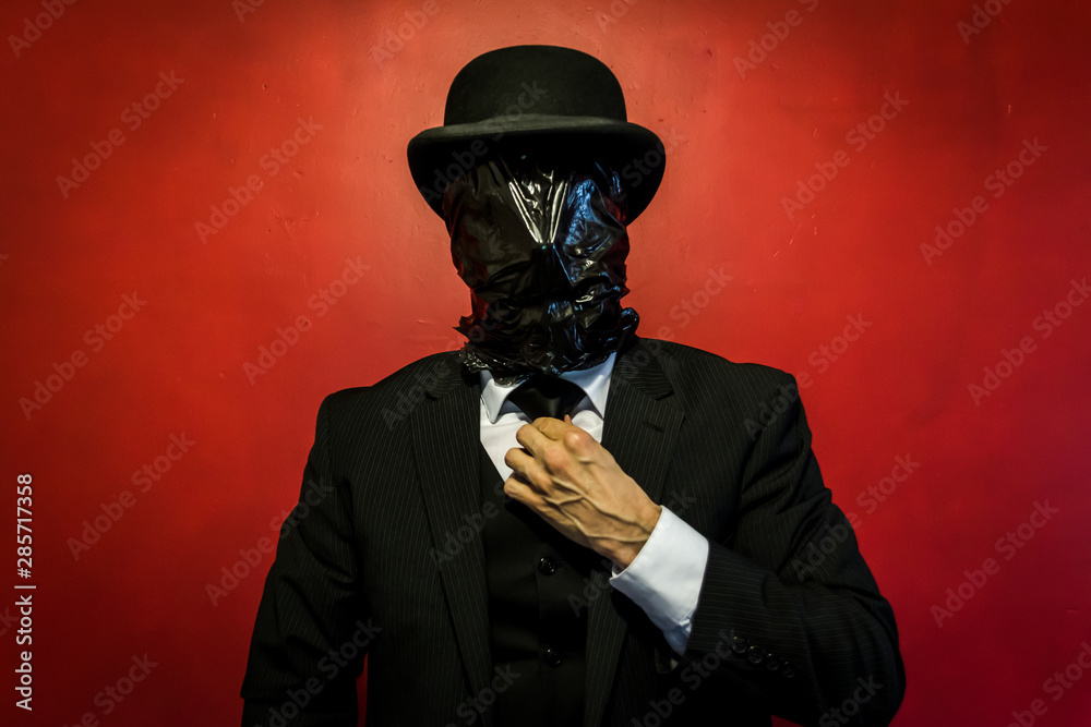 Portrait of Man in Dark Suit and Bowler Had With Black Plastic Bag Over ...