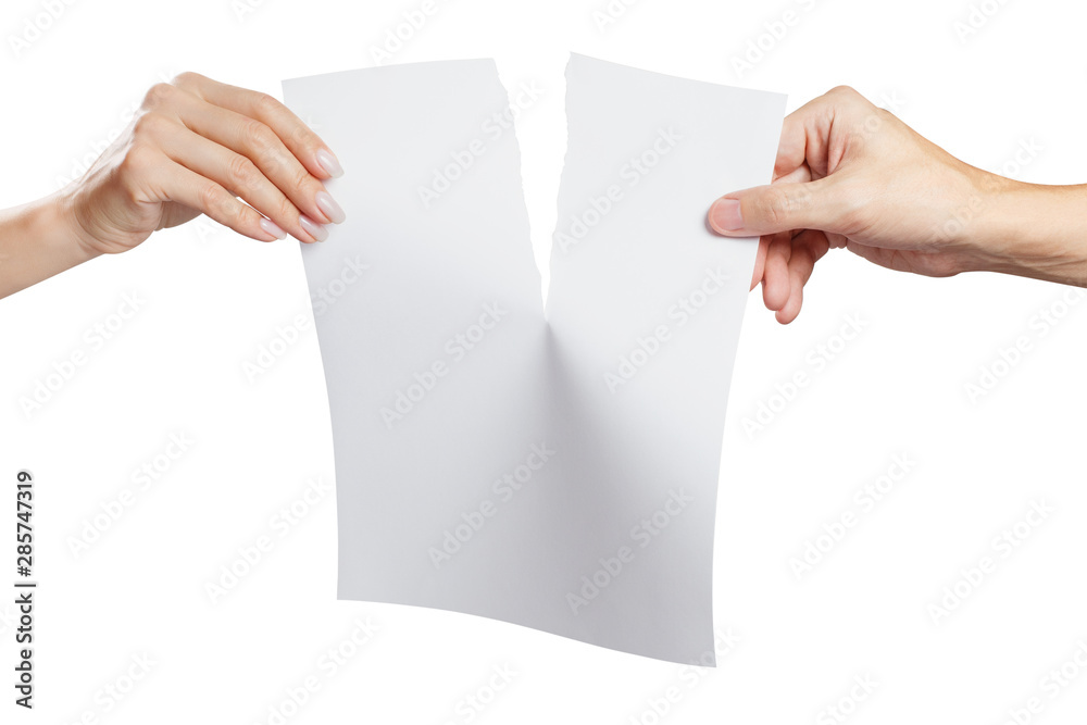 Hands tearing a sheet of white paper in half, isolated on white ...