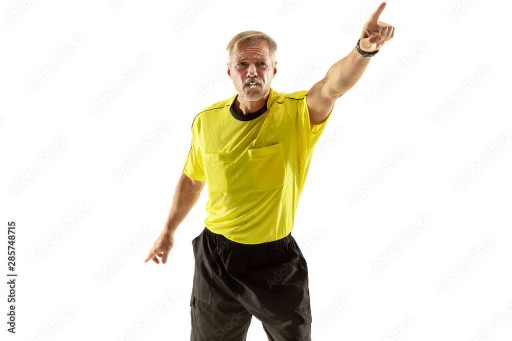 Referee gives directions with gestures to football or soccer players ...