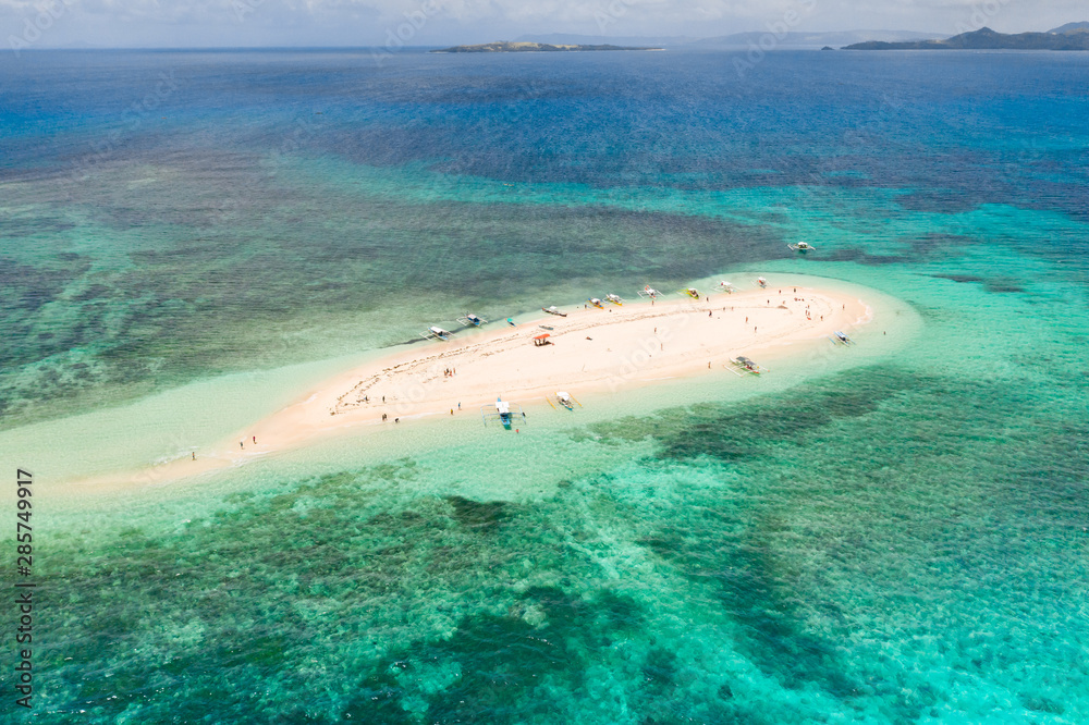 People relax on a tropical island and swim in the lagoon. Naked Island ...