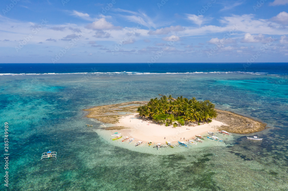 Guyam island, Siargao, Philippines. Small island with palm trees and a ...