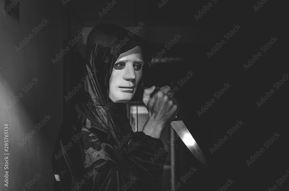 murder, kill and people concept - Criminal or murderer in black wearing ...