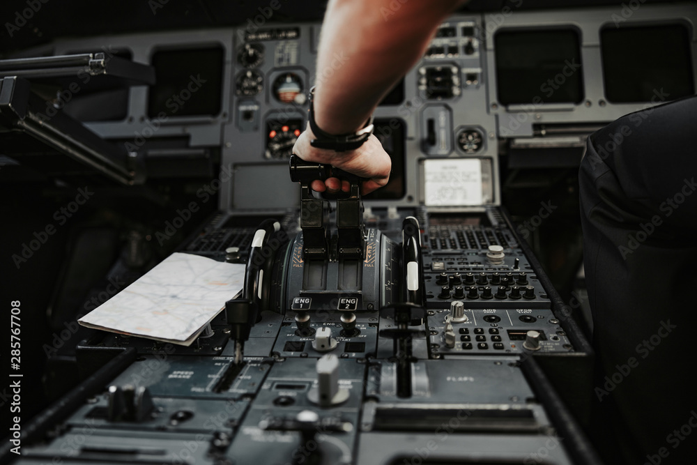 Male arm accelerating on throttle in cockpit of aiplane Stock Photo ...
