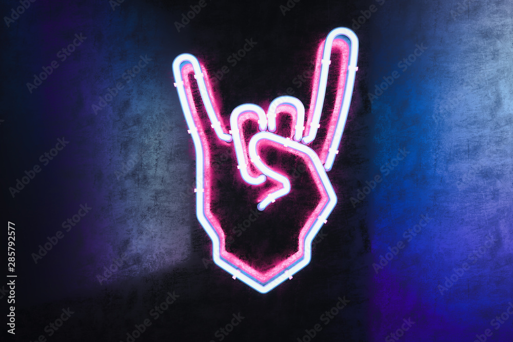 Hand in rock and roll sign made from neon lamps on dark background. 3d ...