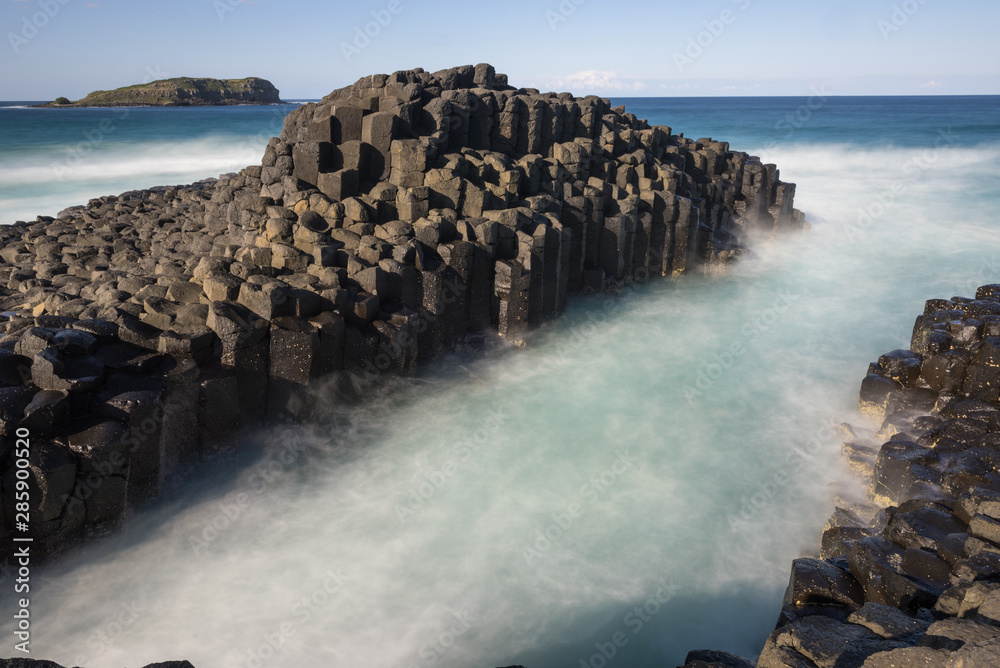 Black, basalt columns on a small island just off the tip of Fingal Head ...
