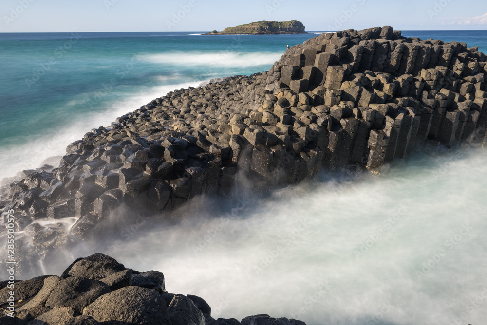 Black, basalt columns on a small island just off the tip of Fingal Head ...