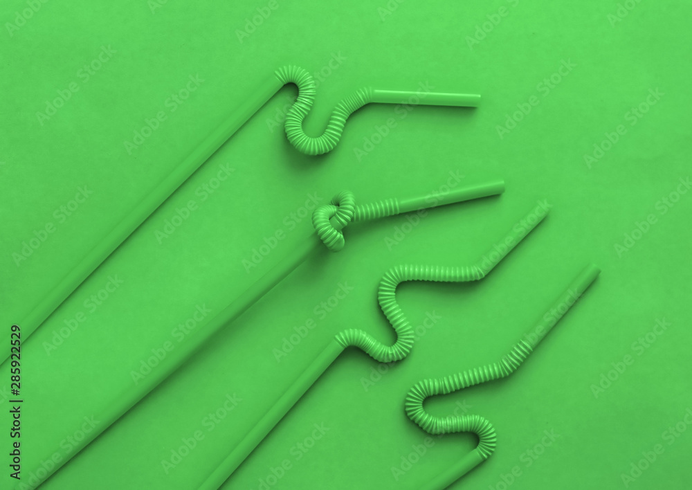 Green plastic cocktail tubes with a flexible part, due to which they ...