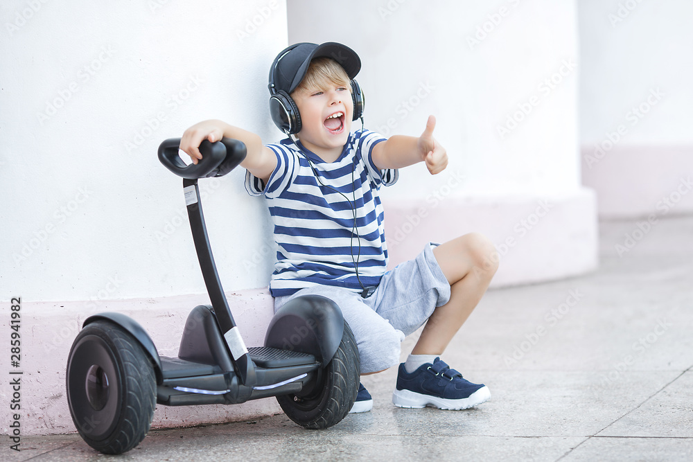 Cute little boy driving segway. Child skating on hyroboard. Boy driving ...