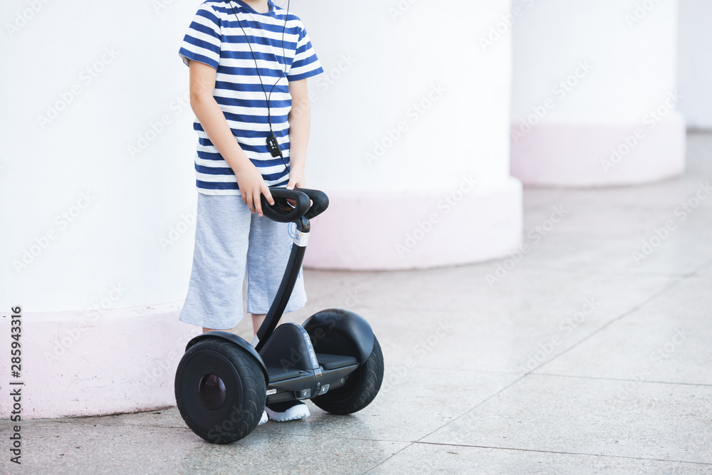 Cute little boy driving segway. Child skating on hyroboard. Boy driving ...