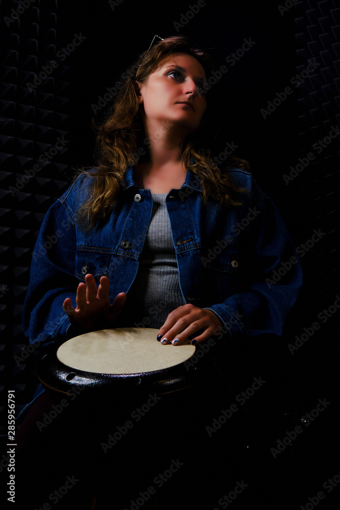 Playing on ethnic African percussion instrument Darbuka, horizontal ...