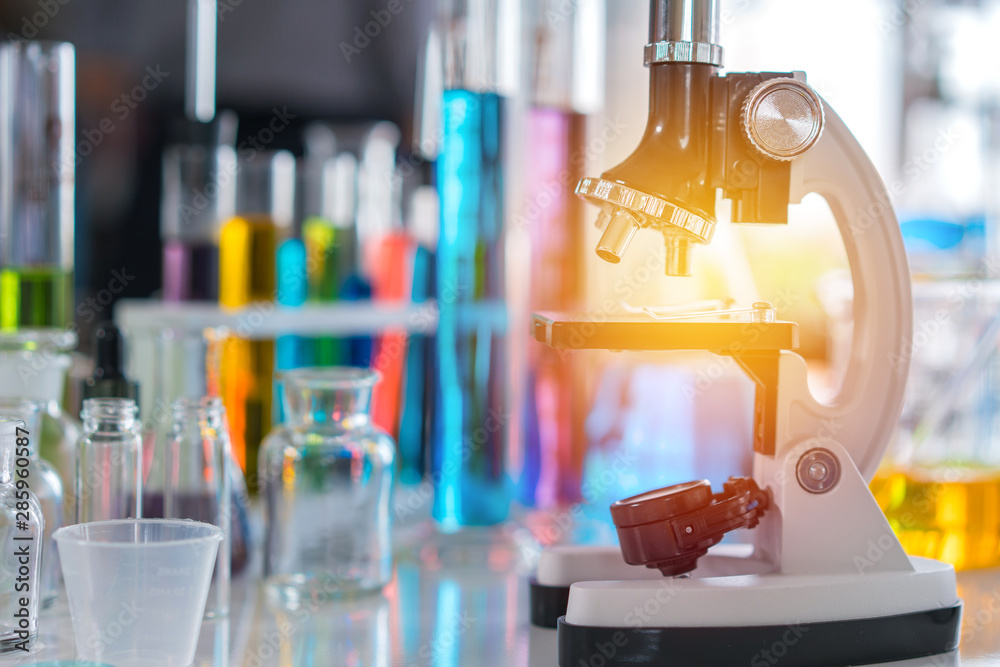 scientist with equipment and science experiments, laboratory glassware ...