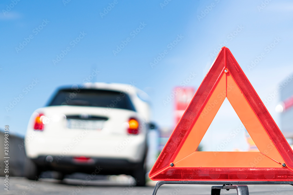 red danger triangle indicating breakdown of a vehicle stopped on the ...