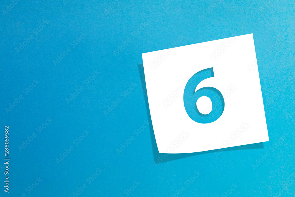 Note paper with number six on blue background Stock Photo | Adobe Stock