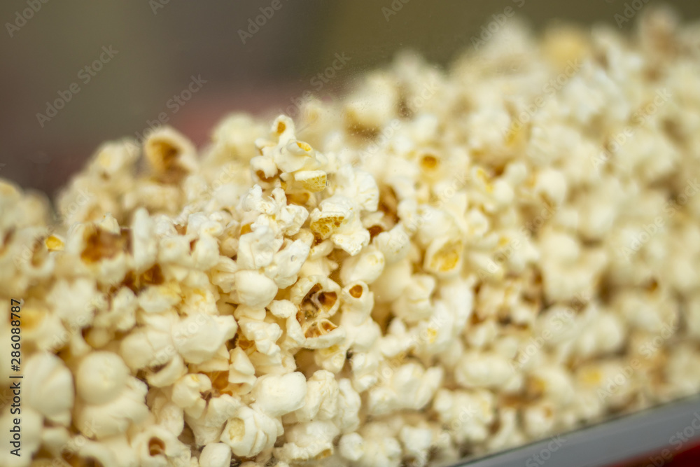 ready popcorn behind glass in a vending machine Stock Photo | Adobe Stock