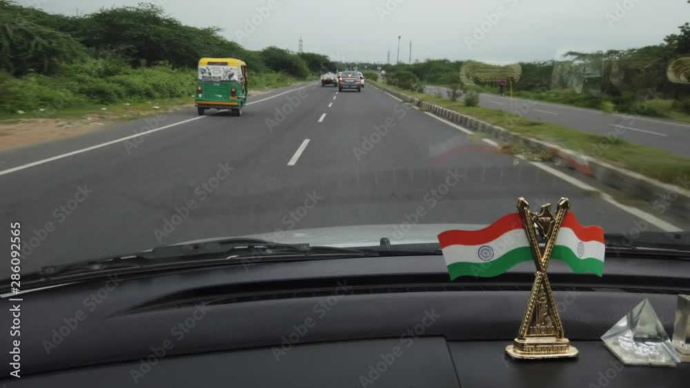 Time-lapse passenger's point-of-view shot from a moving vehicle with ...