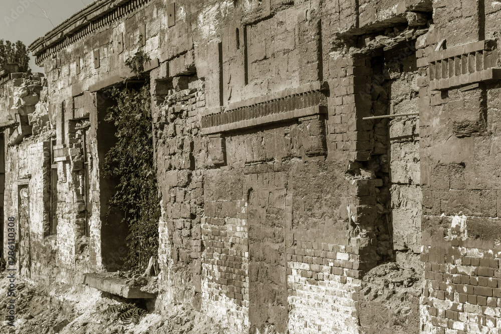 Old wall of destroyed house. Old powder wall with walled window and ...