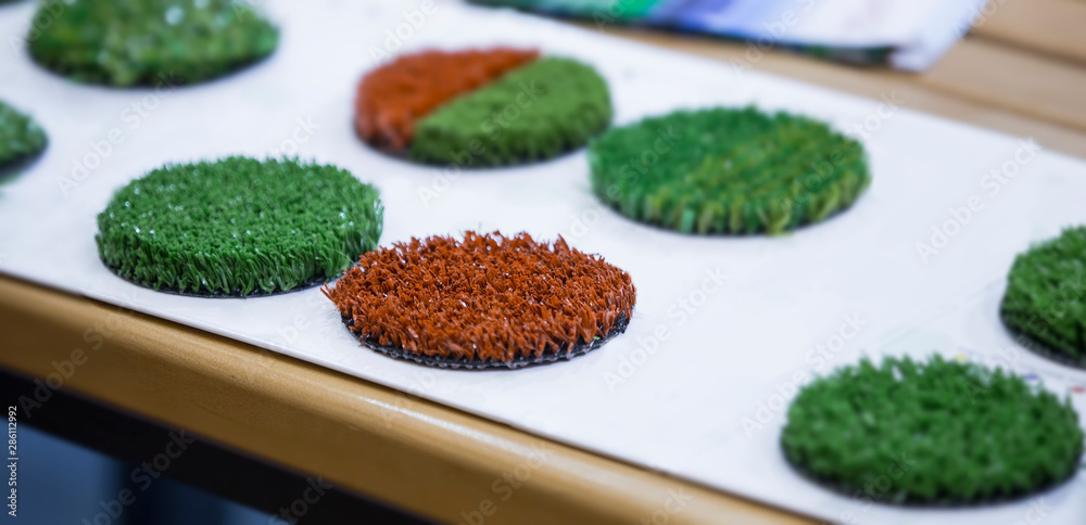 Green and red artificial turf rolled. Probes examples of artificial ...