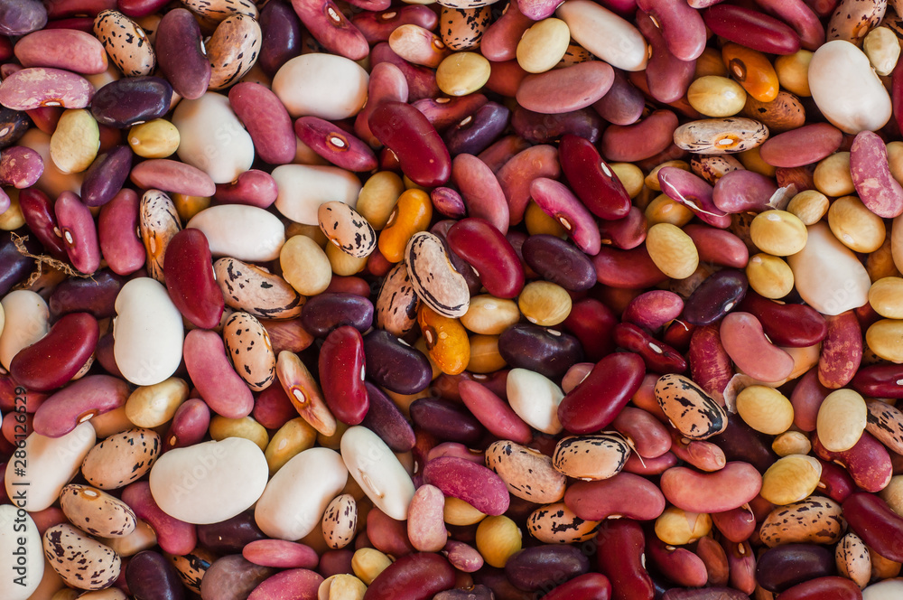 Different types of beans mixed up top view. Background from multi ...