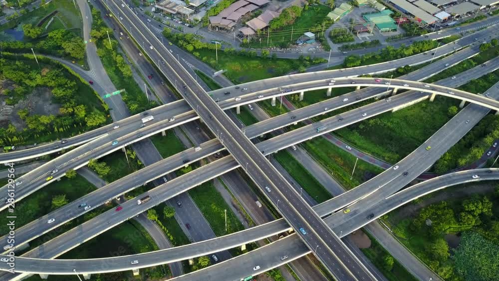 4K. Aerial view of road interchange or highway intersection with busy ...