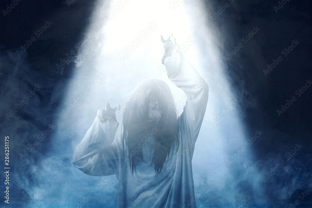 Scary ghost woman with blood and angry face with clawing hands standing ...