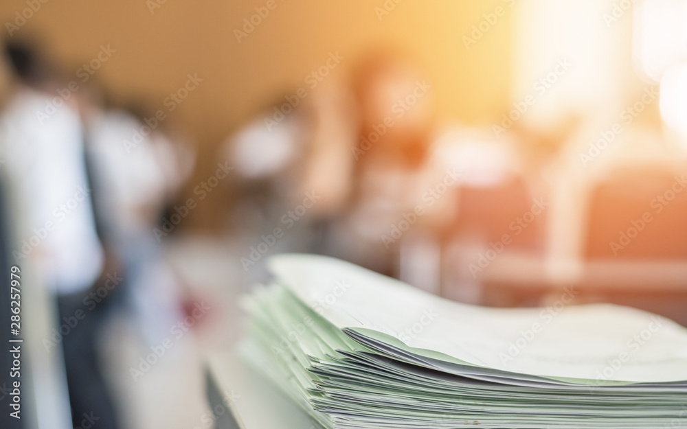 Exam answer sheet or application paper blurry view on table in ...