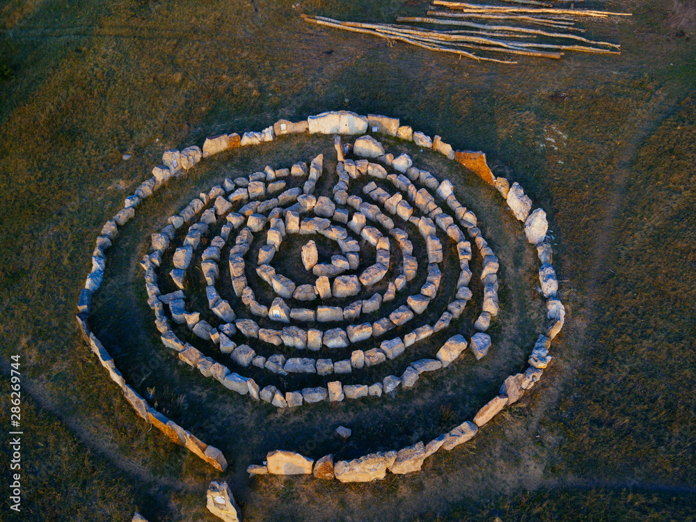 Spiral labyrinth made of stones, top view from drone Stock Photo ...