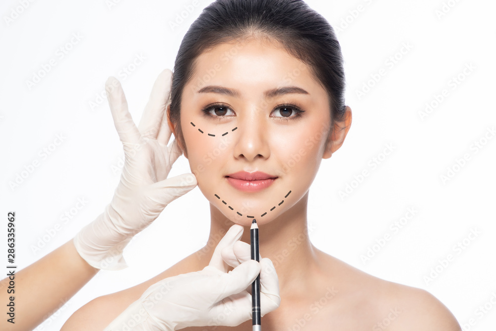 Lines on face, close up, plastic surgery concept, doctor's hand in ...