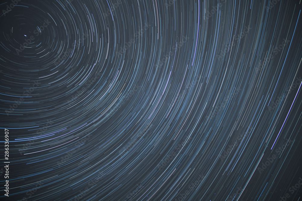 Astro photography time lapse of star trails rotating around the north ...