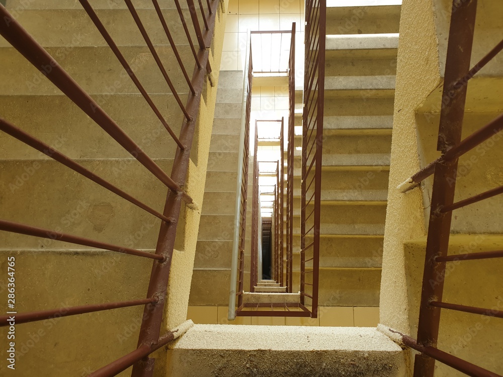 Stairs in a high-rise building. Concrete stairs. Steps in the entrance ...
