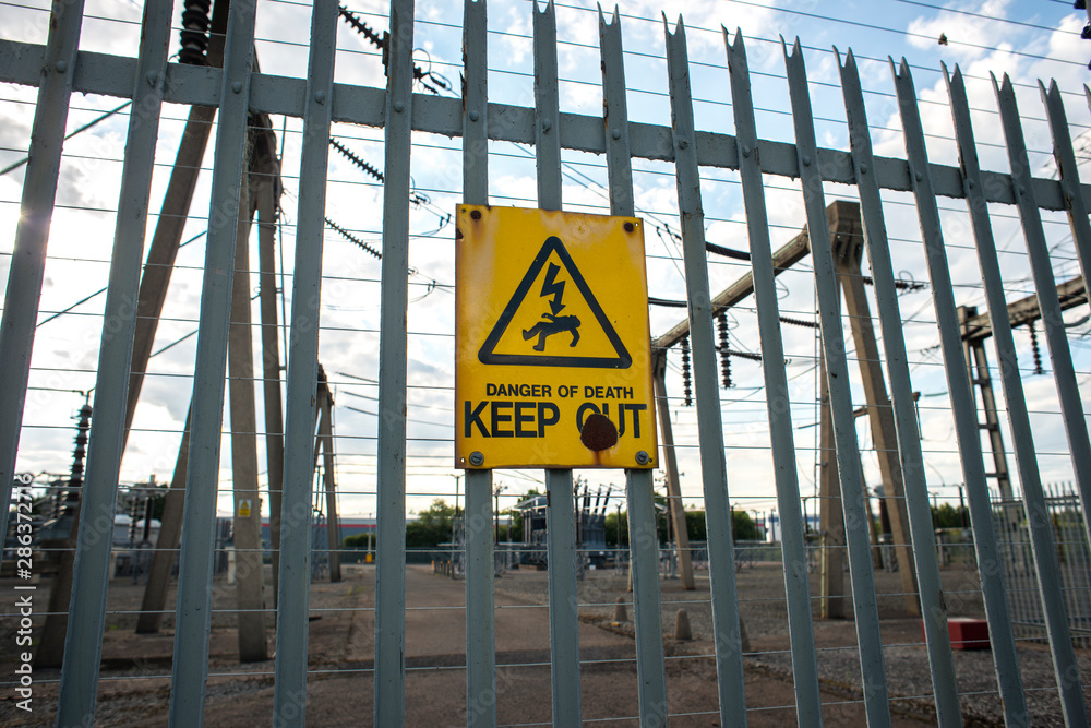 Warning sign on boundary fence of electricity substation, UK Stock ...